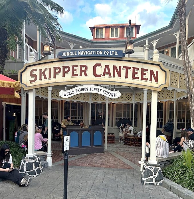 The entrance welcomes adventurous diners with its "World Famous Jungle Cuisine" promise. Palm trees and tropical decor create an instant vacation vibe.