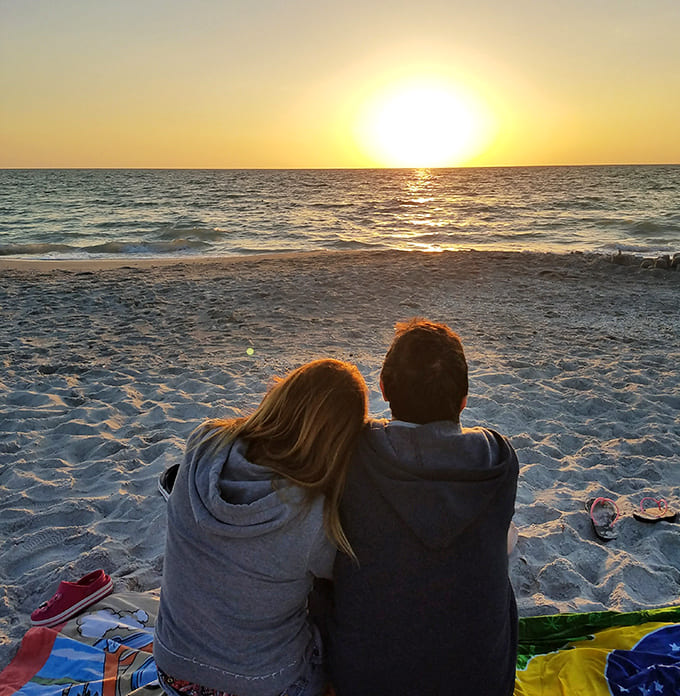 Sometimes the best seat in the house is just a beach blanket and someone you love watching the sky catch fire.