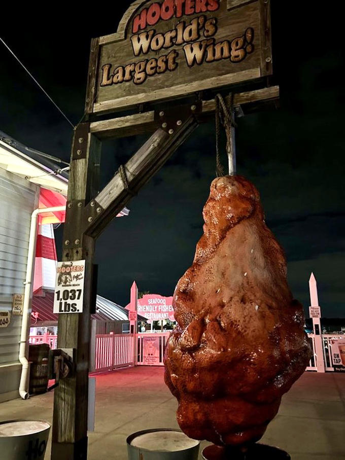 After dark, the illuminated wing becomes a beacon of fried food fantasy against the night sky.