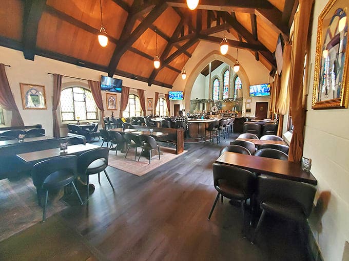 The dining area maintains the church's architectural integrity while transforming the space into a welcoming haven for food and beer lovers alike.