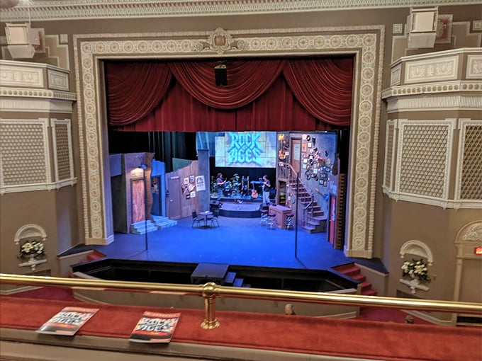 From the balcony, audiences enjoy a sweeping view of elaborate stage sets, meticulously crafted for each unique production.