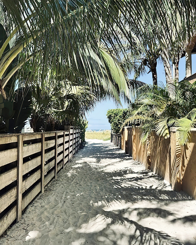 Palm-lined pathways lead to Bean Point Beach, where the only footprints might be your own during early morning treasure hunts.