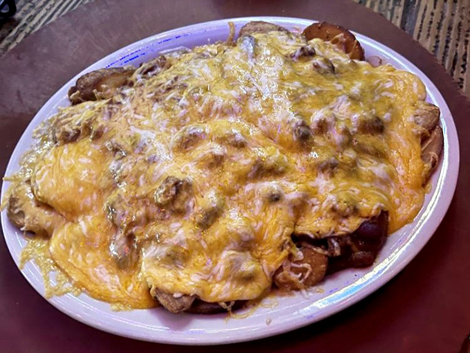 Chili Cheese Fries: A mountain of potato, chili, and cheese that requires both a fork and a strategy &ndash; calories worth every delicious consequence.