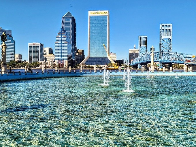 Sunlight penetrates the crystal-clear basin, revealing the intricate underwater mechanics that power Florida's tallest and largest fountain display.