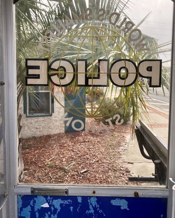 Peering through the glass reveals a world where law enforcement once operated from a space smaller than most closets.