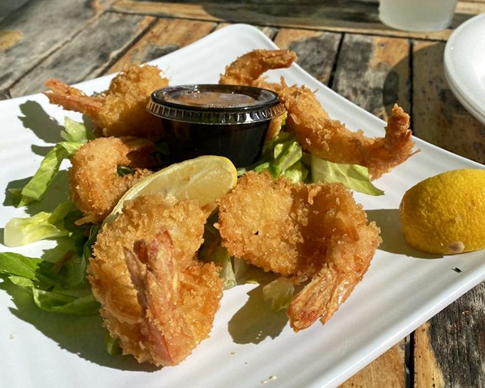 Coconut shrimp that crunch with each bite, revealing sweet tender seafood within &ndash; a tropical vacation for your taste buds.