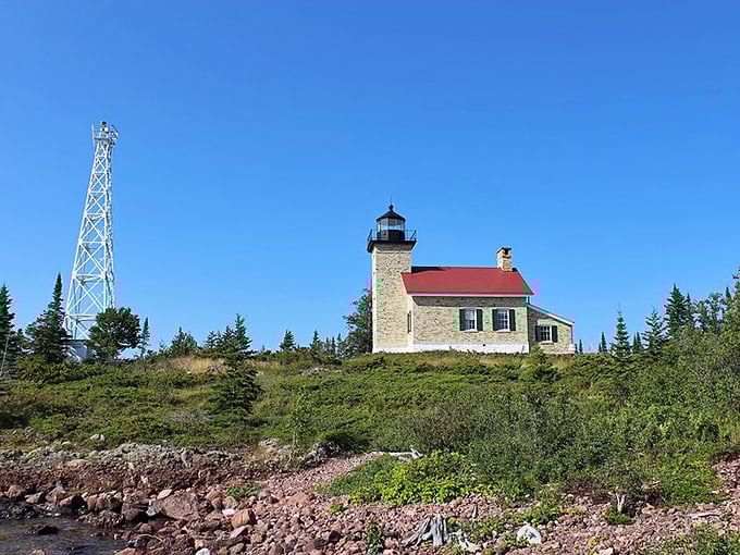 The Copper Harbor Lighthouse stands as a steadfast guardian, its stone walls telling tales of shipwrecks and survival.