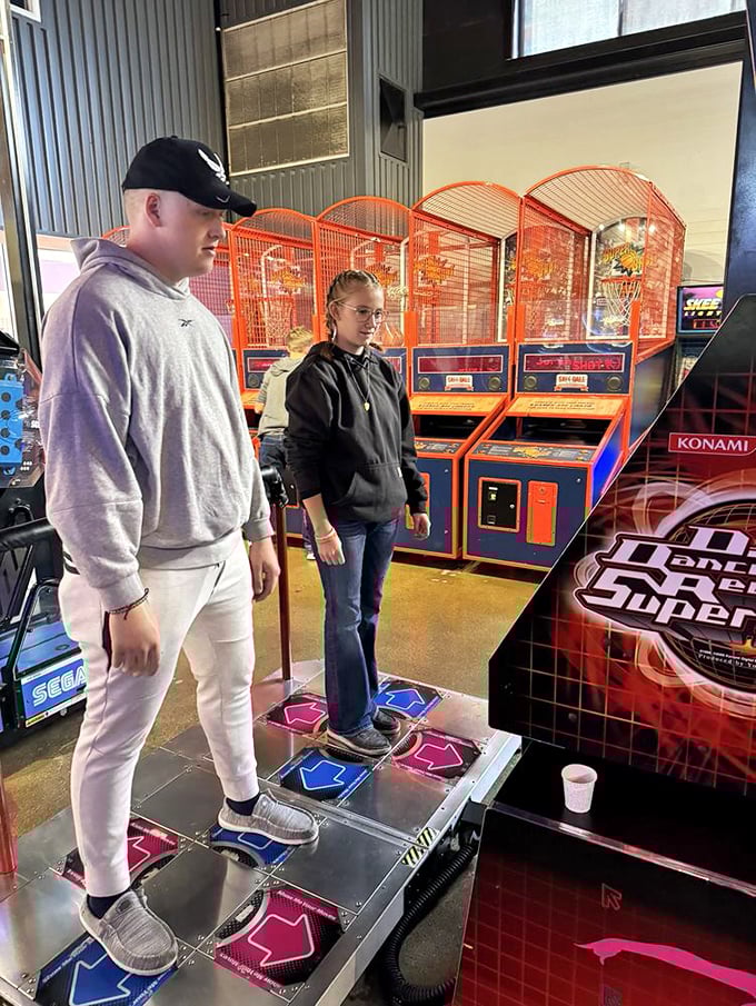Dance Dance Revolution: where coordination meets public spectacle and everyone watching secretly wishes they had the courage to try it too.