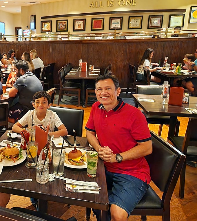 Happy diners enjoying the Hard Rock experience – where every table feels like front-row seats to a feast of flavor and atmosphere.