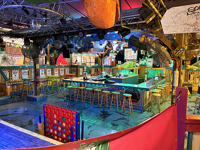 The bar where stories get better with each round. Notice the surfboard overhead&mdash;it's seen fewer waves than the bartenders have seen tourists.