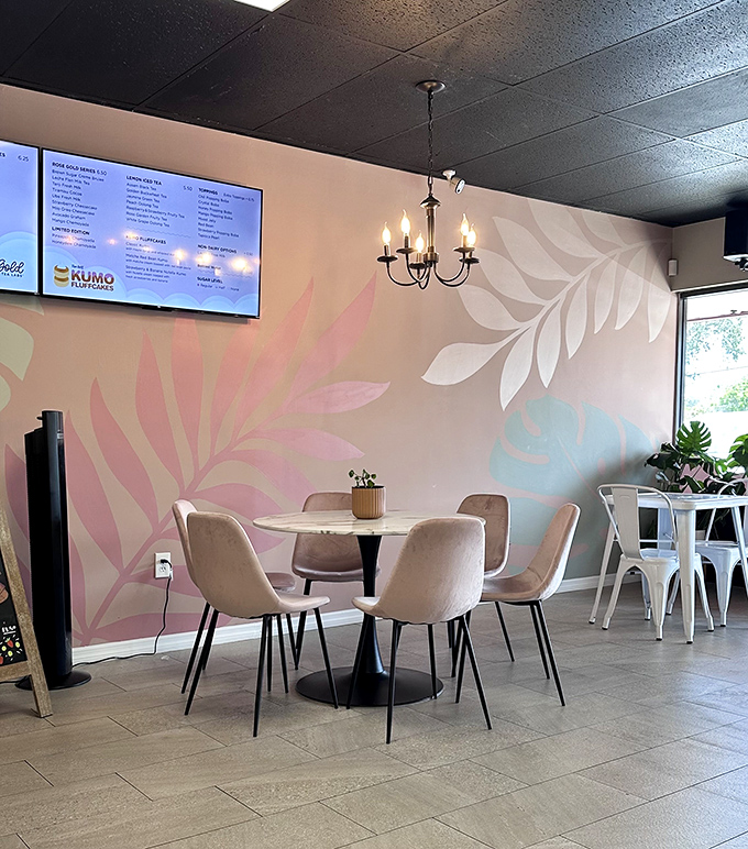 Soft pastels and botanical murals create a dining area that feels like stepping into a sophisticated yet approachable oasis away from Florida's humidity.