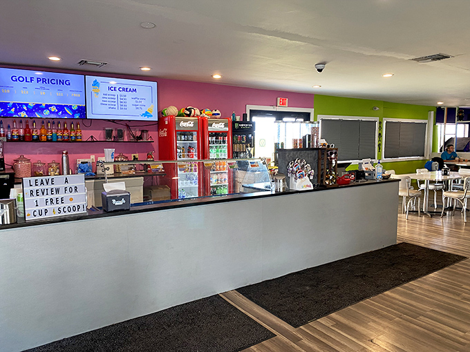 Ice cream shop: Command central for frozen delights! The counter stands ready for hungry golfers, with a sign promising free scoops for those who share their cosmic experiences.