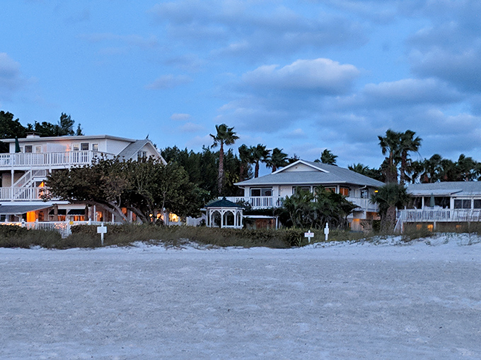 As evening approaches, beachfront homes light up like birthday cakes, celebrating another perfect day in paradise.