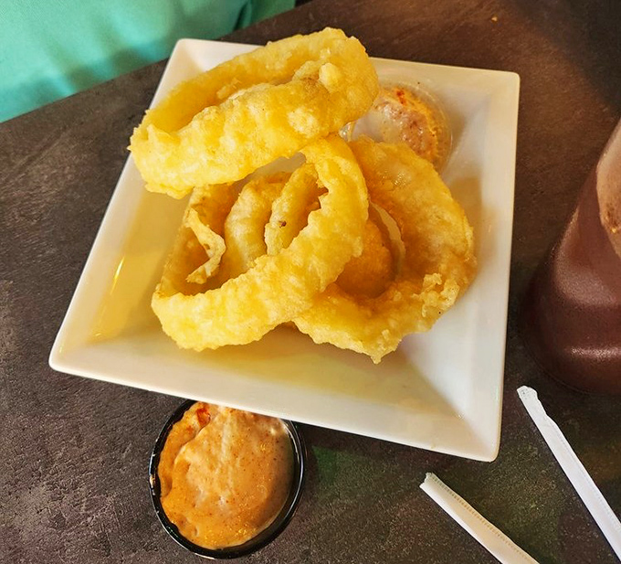 Crispy golden halos that make you question why onions ever appear in any other form&mdash;especially when paired with that creamy dipping sauce.