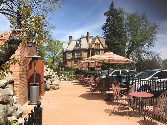 Alfresco Elegance: The castle's patio seating invites guests to enjoy Michigan's perfect summer days against a backdrop of historic architecture.