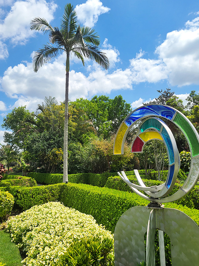 Modern art meets ancient gardening traditions in this colorful sculpture, adding a playful contemporary note to the classical landscape design.