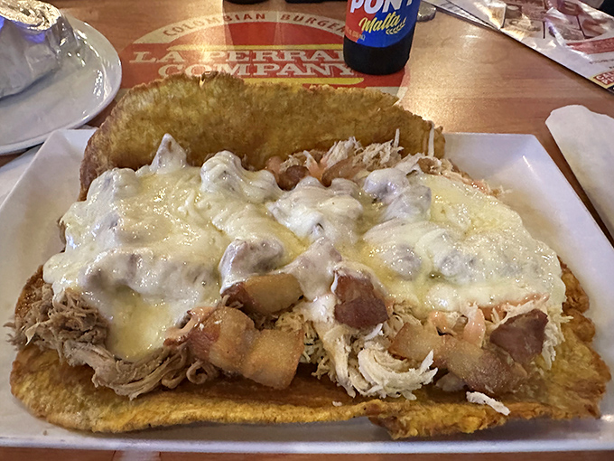 This patac&oacute;n looks like what would happen if a tostada and a cheese pizza had a beautiful, savory love child.