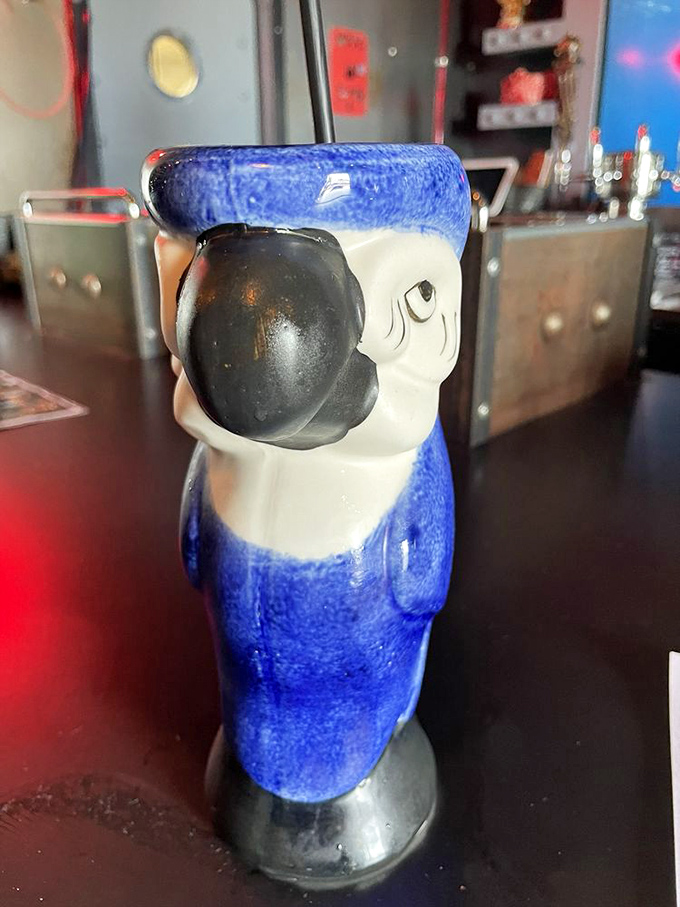 This sailor-themed ceramic parrot doesn't just hold your drink &ndash; he judges your life choices with that side-eye while you sip.