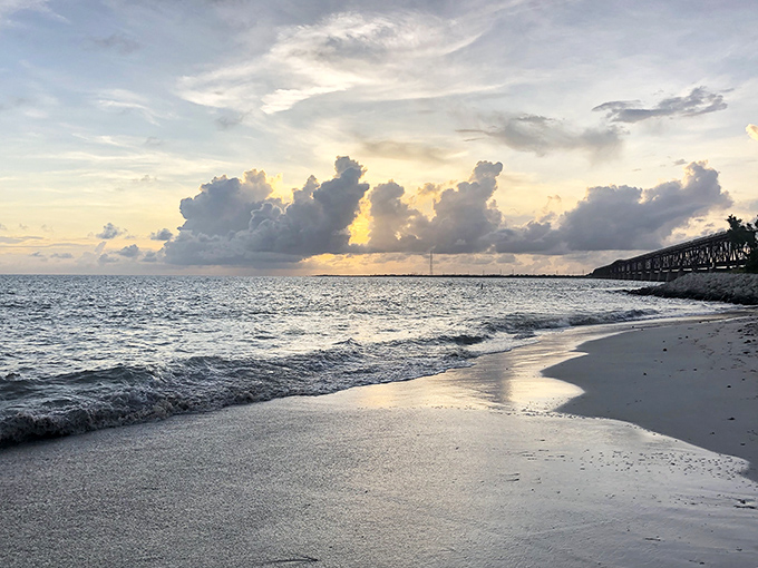 Golden hour magic: As day surrenders to evening, the shoreline transforms into a canvas of amber light that makes even non-poets wax poetic.
