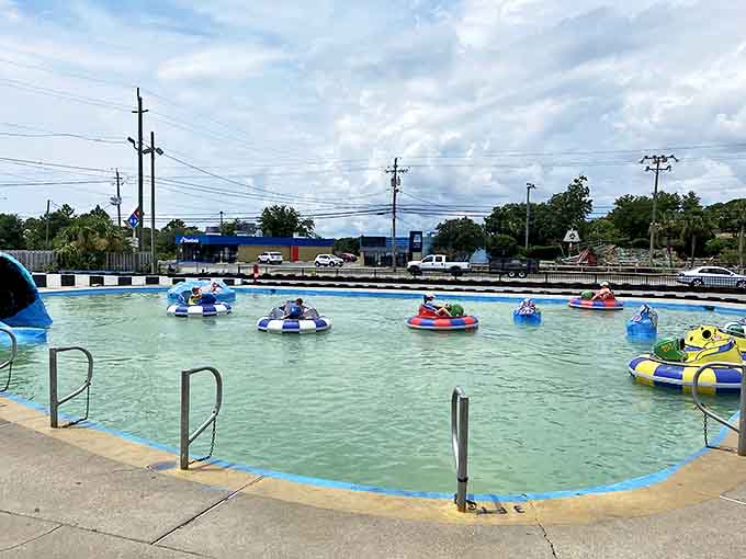 Colorful circular vessels drift in crystal blue waters, like a peaceful lake scene until someone discovers the splash button.