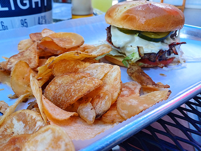 House-made chips surround a burger that's been kissed by the same smoke that makes the wings legendary.