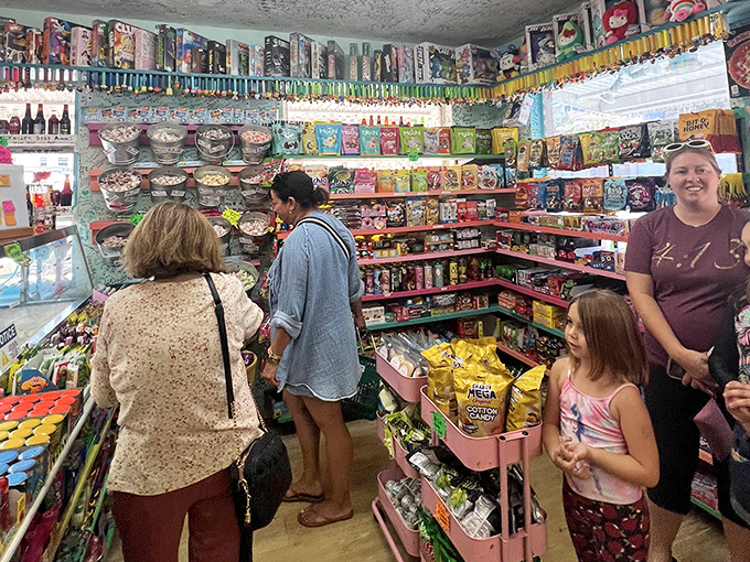 Customers browse the candy-packed shelves with the focused concentration of archaeologists discovering the world's most delicious dig site.