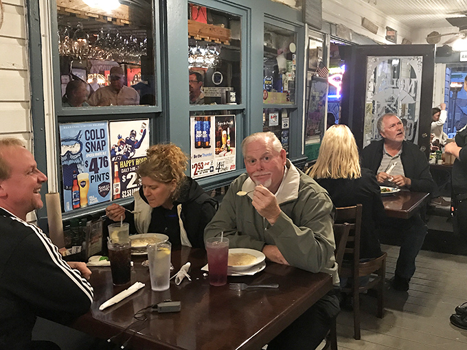 Island time is the only time that matters here, where locals and tourists alike bond over cold drinks and the shared religion of perfectly prepared seafood.