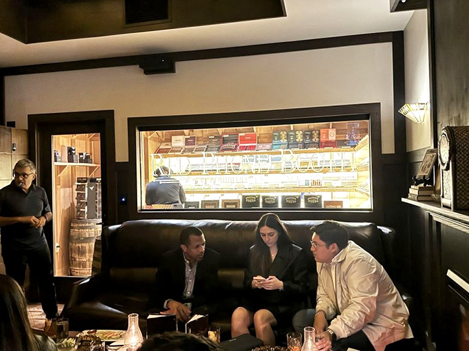 Patrons enjoy the intimate atmosphere where conversations flow as smoothly as the premium spirits, creating memories in this hidden Miami gem.