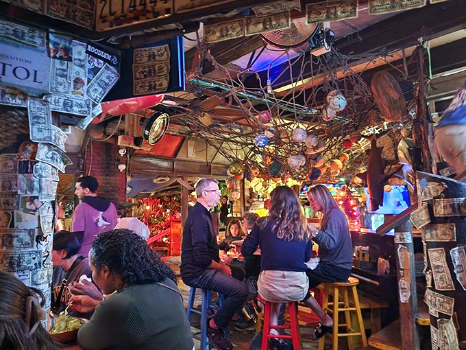 The dining room buzzes with the happy murmur of burger enthusiasts. Dollar bills and license plates create the ultimate Florida time capsule.