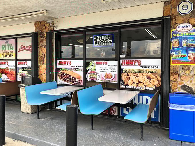 Simple outdoor seating invites weary travelers to rest their legs and fill their bellies while watching the world roll by.