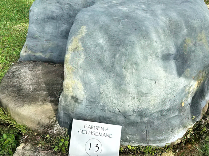 A simple marker identifies the Garden of Gethsemane replica, offering visitors a moment of reflection amid Florida's tropical landscape.