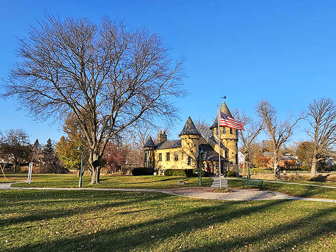 Morning light bathes the castle's distinctive silhouette, highlighting the fieldstones embedded in its stucco walls like jewels in a crown.