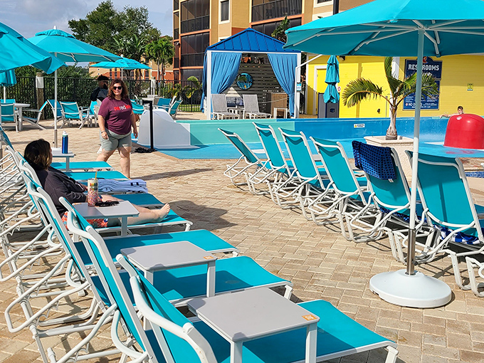 Turquoise chaise lounges await sun-worshippers, arranged like a color-coordinated invitation to practice the fine art of doing nothing.