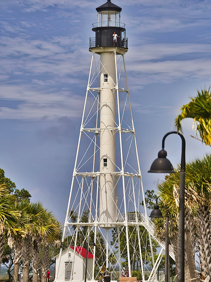 Cape San Blas Lighthouse stands tall and proud, its white tower and black top creating a striking landmark against Florida's Forgotten Coast skyline.