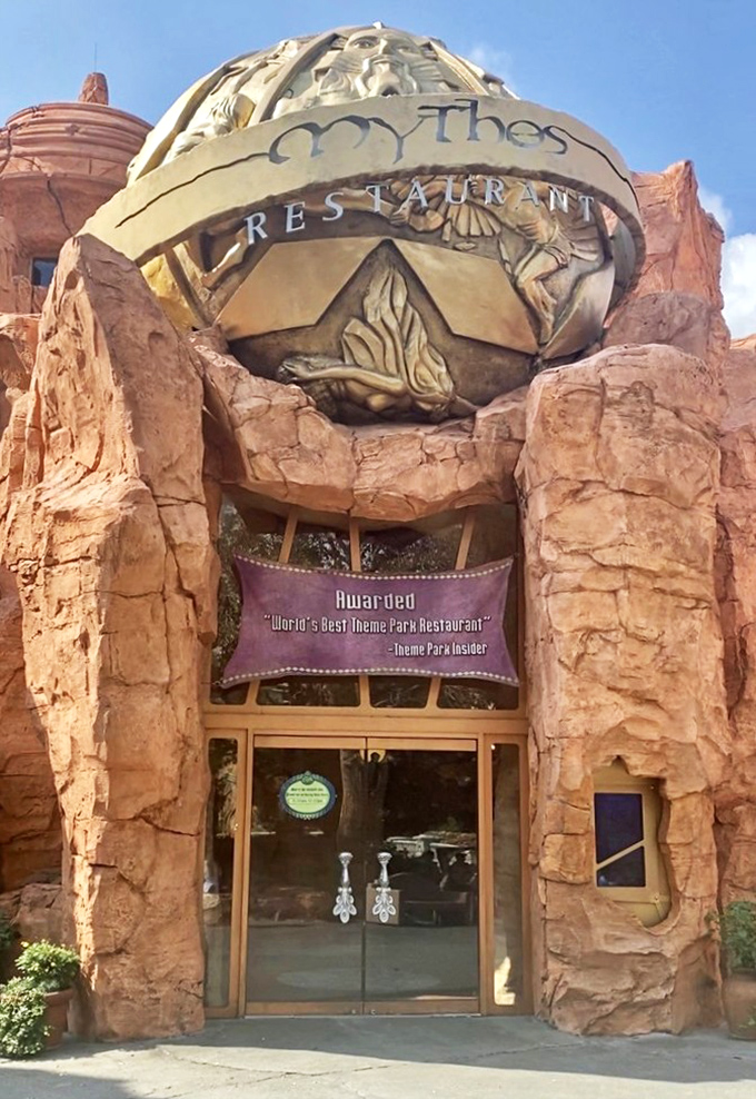 Mythos Restaurant's dramatic rock formation exterior looks carved by ancient gods. This award-winning restaurant blends naturally into the theme park's mythological landscape.