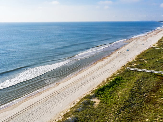 The natural beauty of this barrier island remains largely unspoiled, with dunes and sea oats framing perfect beach days.