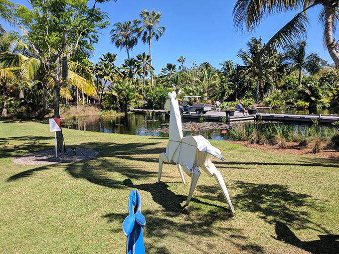 Geometric precision meets natural beauty as this origami-inspired horse sculpture stands poised to gallop across Naples Botanical Garden.