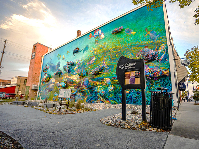 A vibrant underwater world erupts from brick and mortar, transforming downtown Alpena into an aquatic wonderland that defies architectural reality.