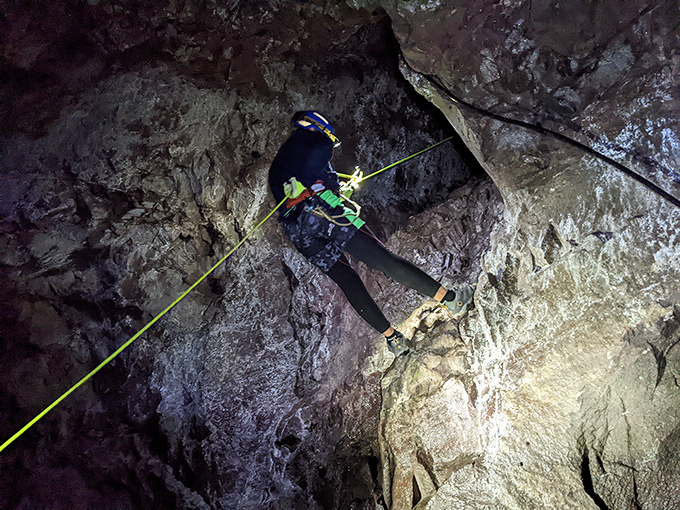 A daring explorer navigates the vertical challenges of Adventure Mining Company's underground labyrinth, where history and adrenaline flow like the copper veins themselves.