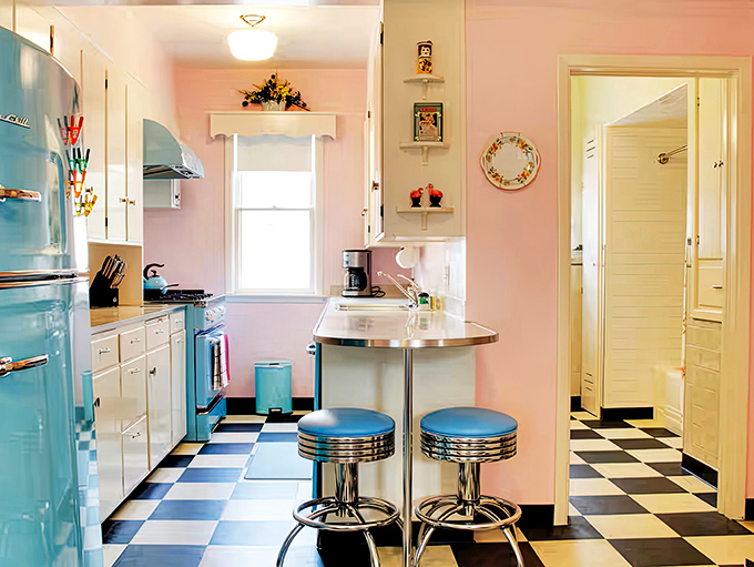 A pastel dream kitchen where turquoise appliances pop against checkerboard floors &ndash; Betty Crocker would definitely approve!
