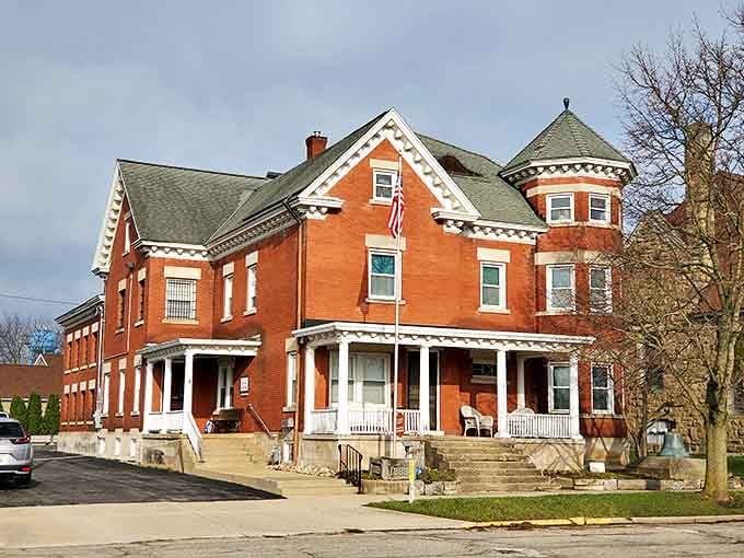 The imposing red brick Victorian architecture of the Allegan County Historical Museum hides its former life as the county jail behind elegant details.