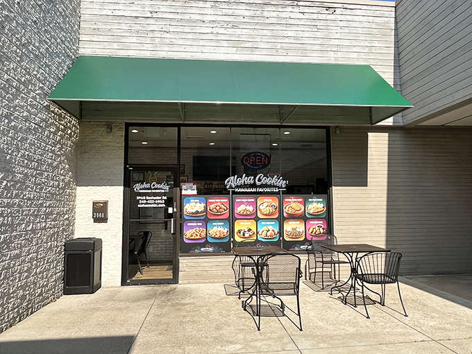 That cheerful green awning is your beacon to Hawaiian paradise, right here in landlocked Michigan where palm trees are purely decorative.