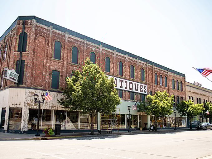 The imposing brick fa&ccedil;ade of Bay City Antiques Center stands like a time portal on the main street, promising treasures within its historic walls.