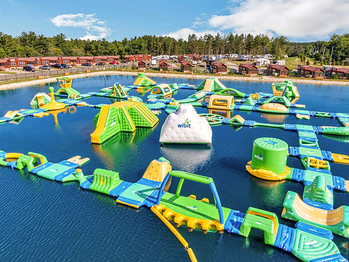 A floating wonderland of blue and green inflatables stretches across Quarry Lake, promising adventures that would make even the most serious adult giggle uncontrollably.