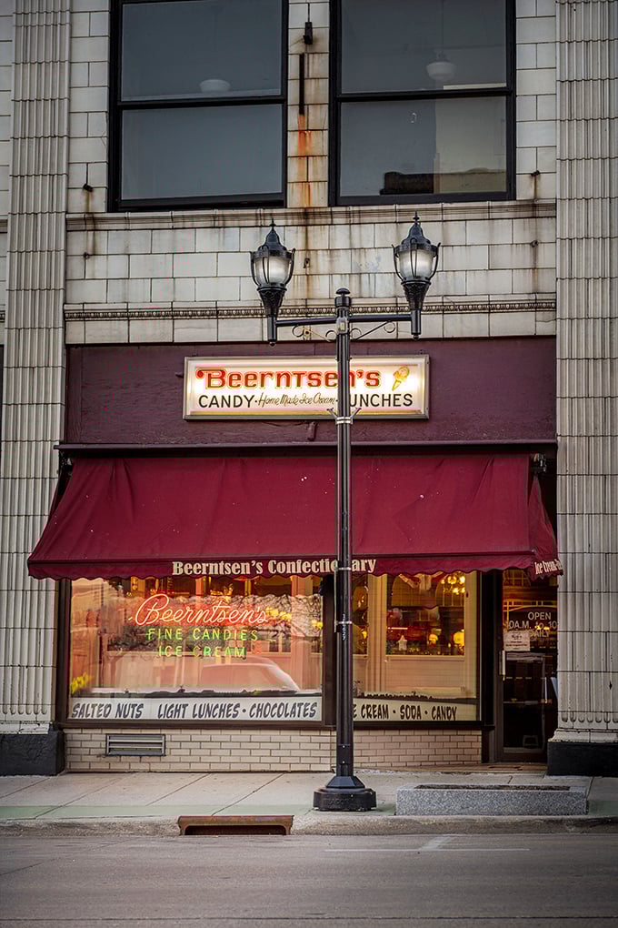 A crimson awning and vintage signage beckon sweet-toothed visitors into this time capsule of confectionery delights on Manitowoc's historic streets.
