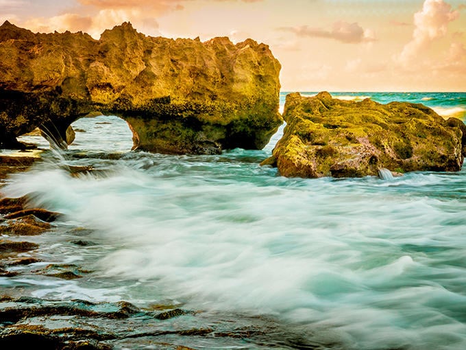 Ancient limestone meets the relentless ocean at Blowing Rocks Preserve, creating nature's own spectacular fountain show when conditions align perfectly.