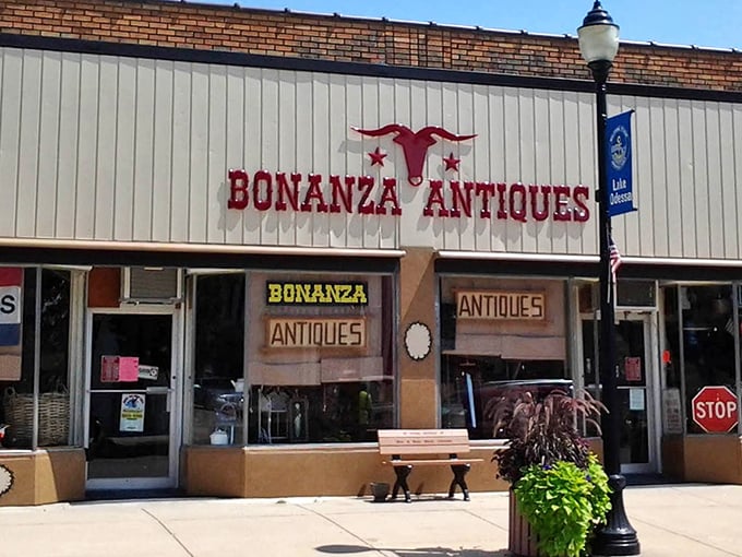 The iconic red longhorn logo welcomes treasure hunters to Bonanza Antiques, Lake Odessa's time capsule of American nostalgia.
