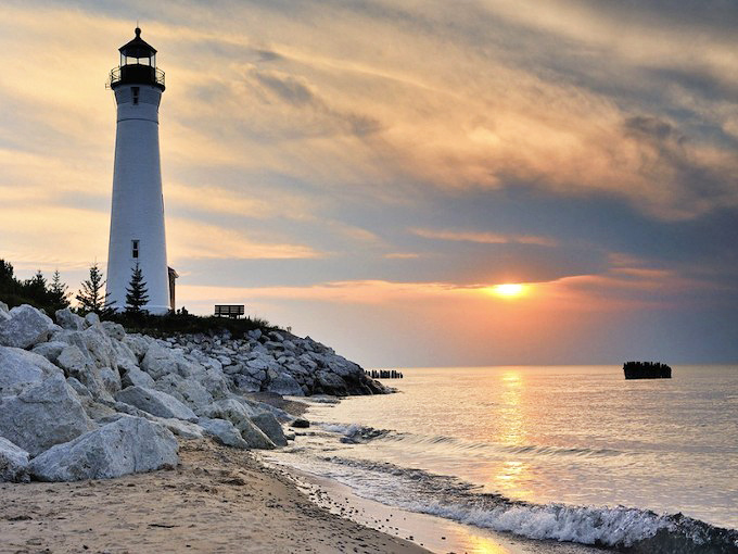 Crisp Point Lighthouse: Where Lake Superior kisses the sky, this gleaming sentinel stands watch over one of Michigan's most breathtaking coastal panoramas.