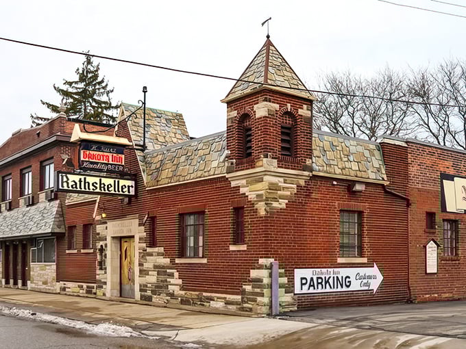 The iconic brick exterior of Dakota Inn Rathskeller stands like a Bavarian time capsule in Detroit, its distinctive turret and vintage sign beckoning hungry travelers since 1933.