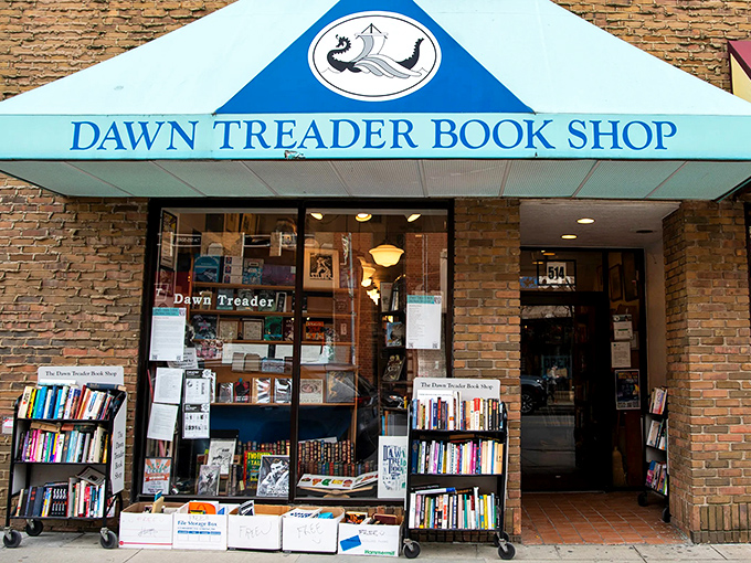 Dawn Treader Book Shop's iconic blue awning stands like a literary lighthouse on Liberty Street, beckoning bibliophiles with promises of undiscovered treasures within.
